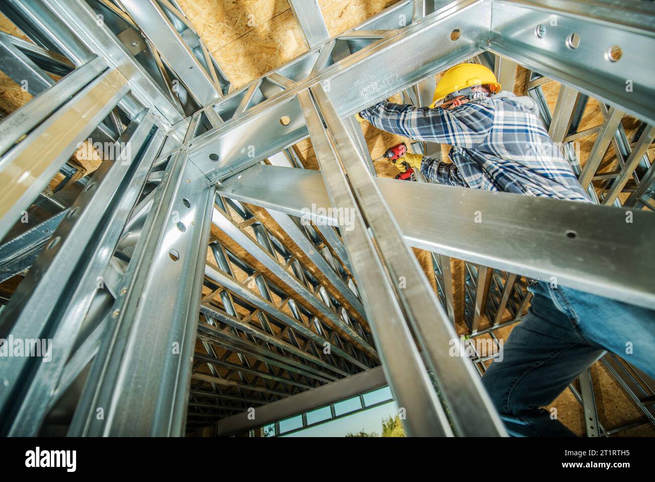 Caucasian Construction Worker Attaching Metal Frame Elements Using ...
