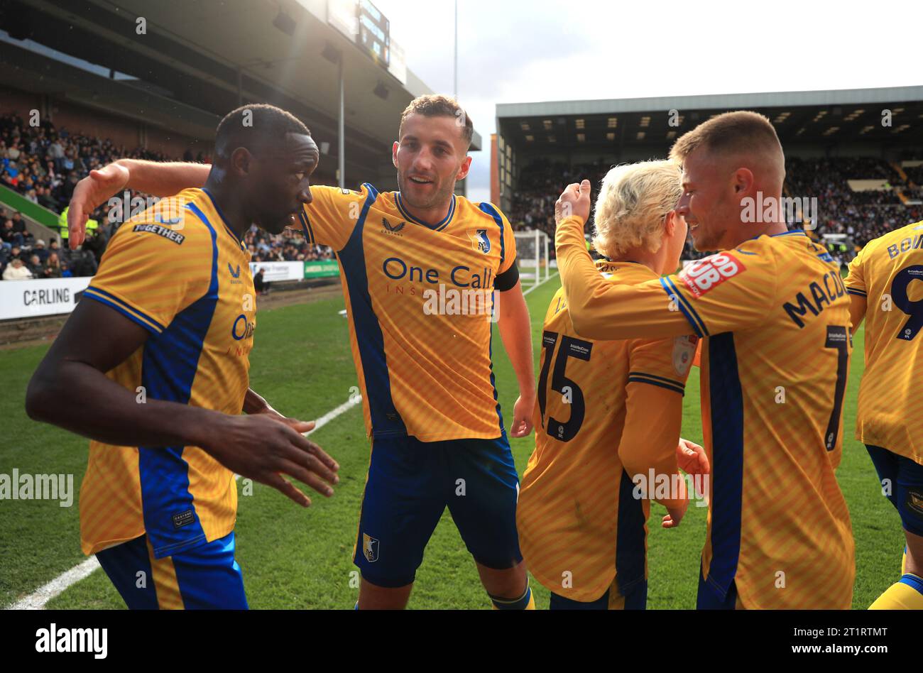 Mansfield Town’s Lucas Akins (left) celebrates scoring his sides forth ...