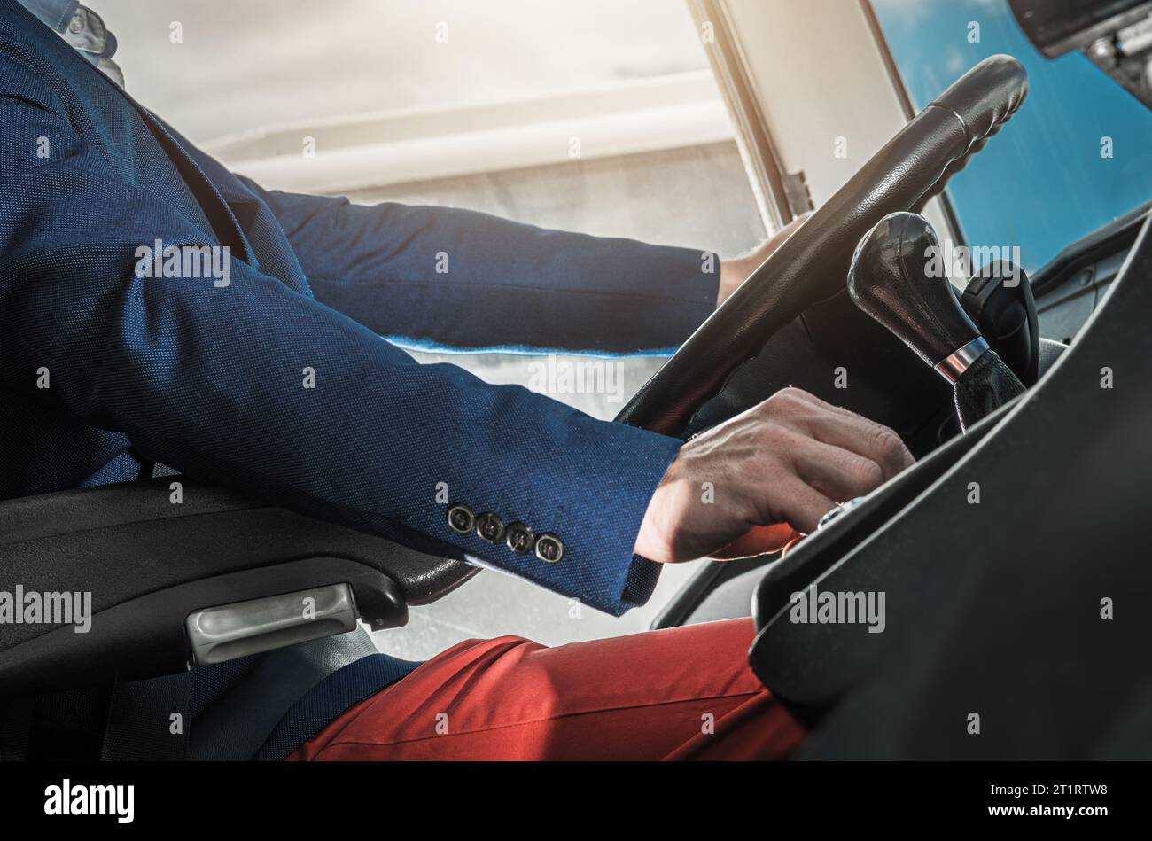 Driver Behind Large Coach Bus Steering Wheel Top View. Commercial ...