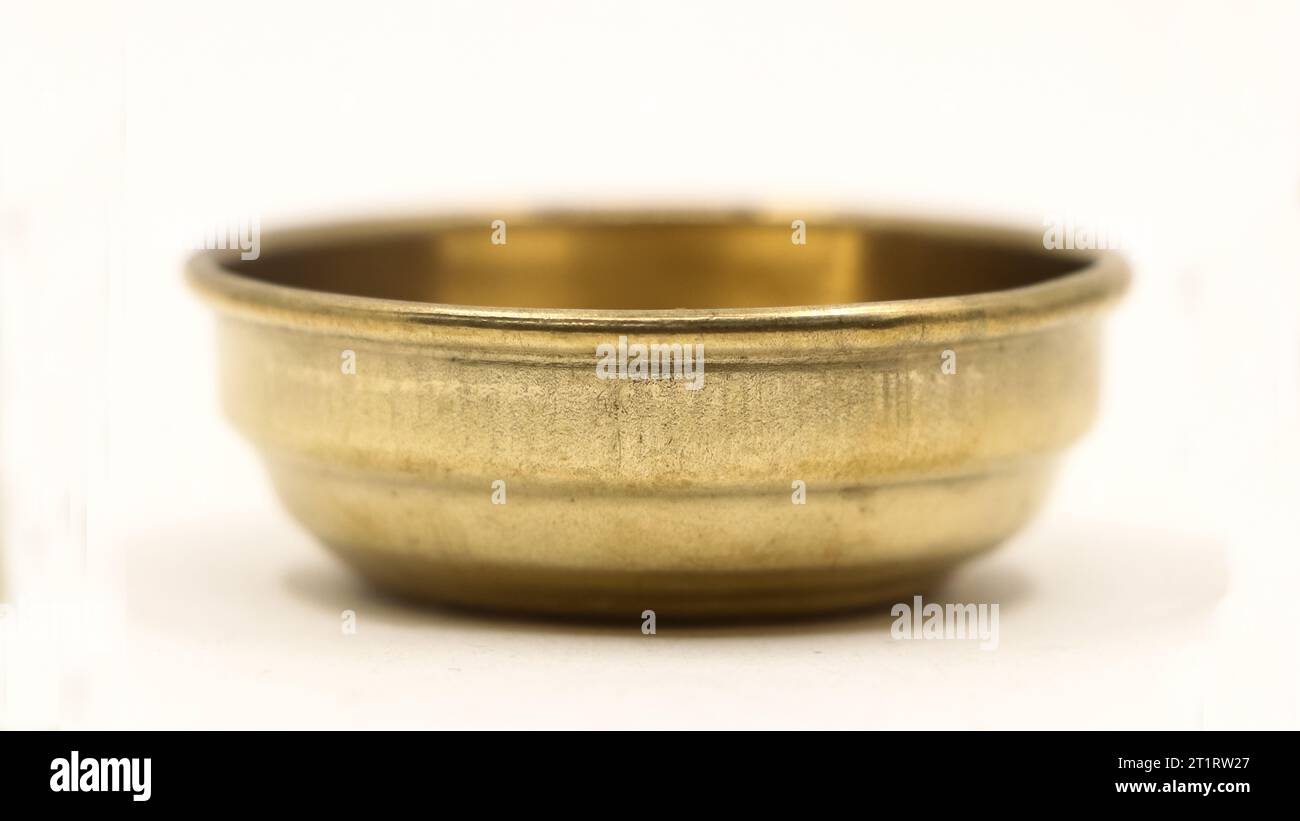 closeup of empty gold bowl plate used in the kitchen as a symbol of ...