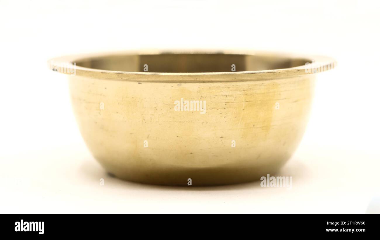 closeup of empty gold bowl plate used in the kitchen as a symbol of ...