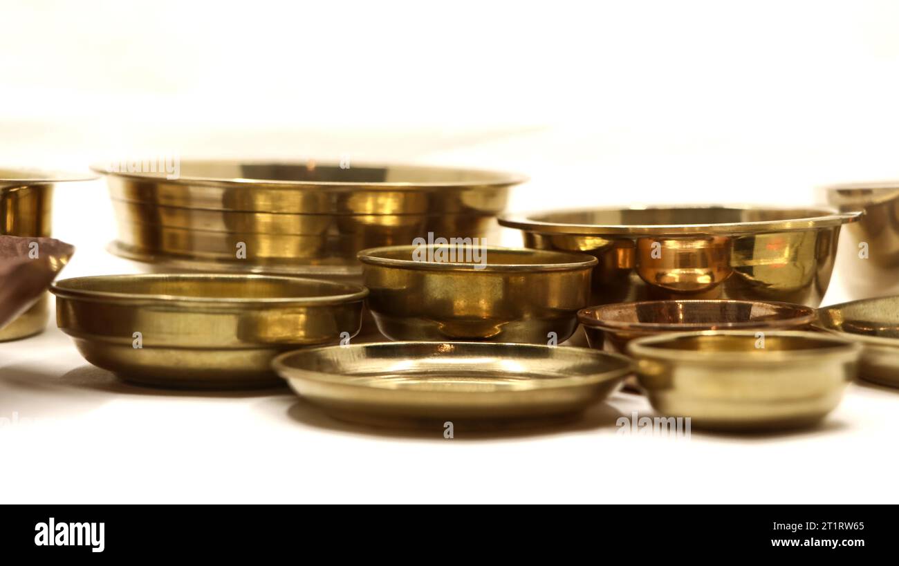 closeup of old antique gold bowl plates used in a luxury kitchen ...
