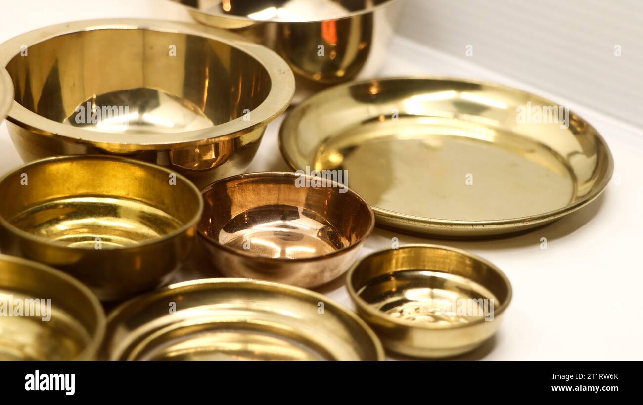 closeup of old antique gold bowl plates used in a luxury kitchen ...