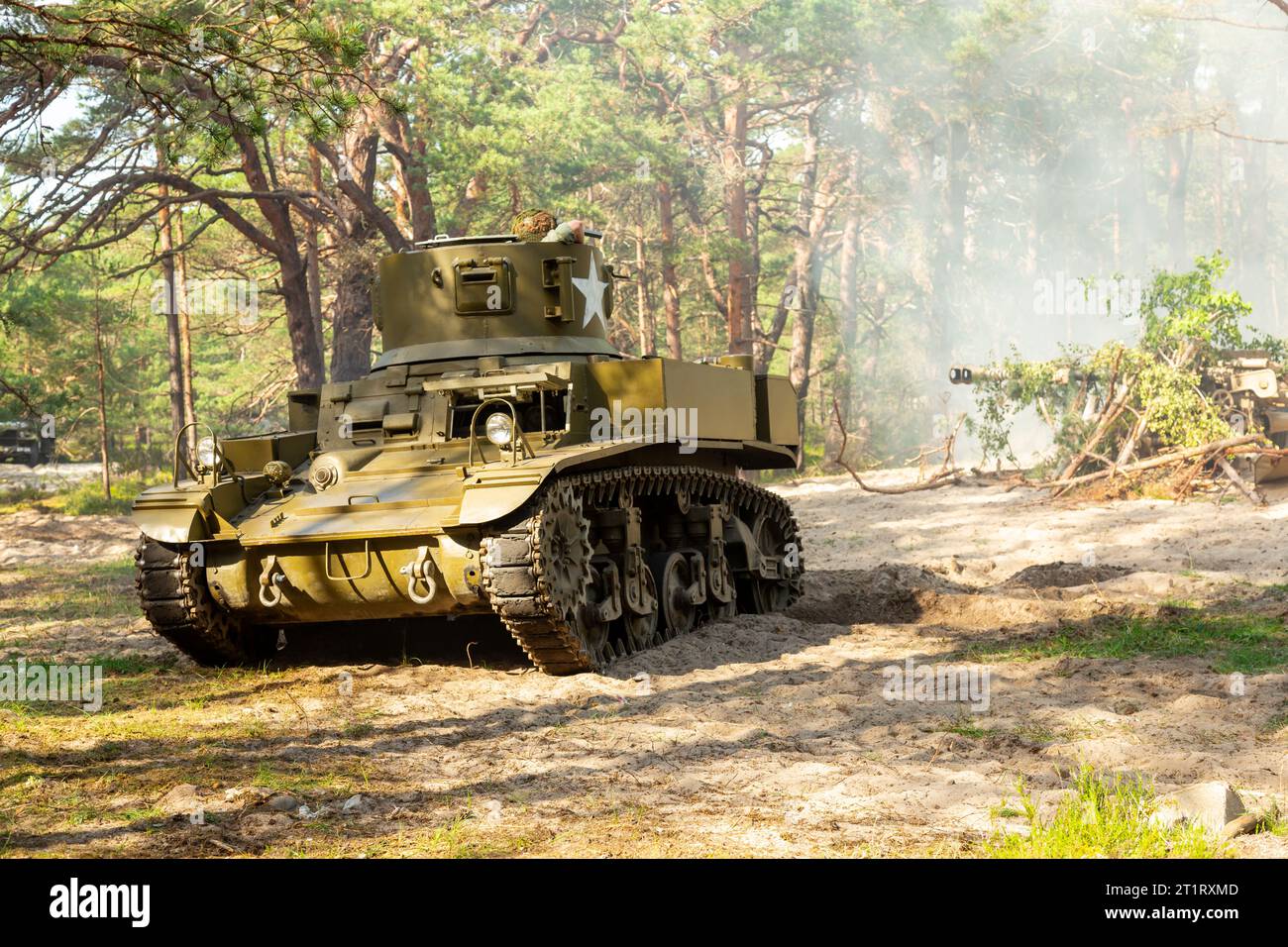 An American World War II Stuart light tank. Tank in the field of battle ...