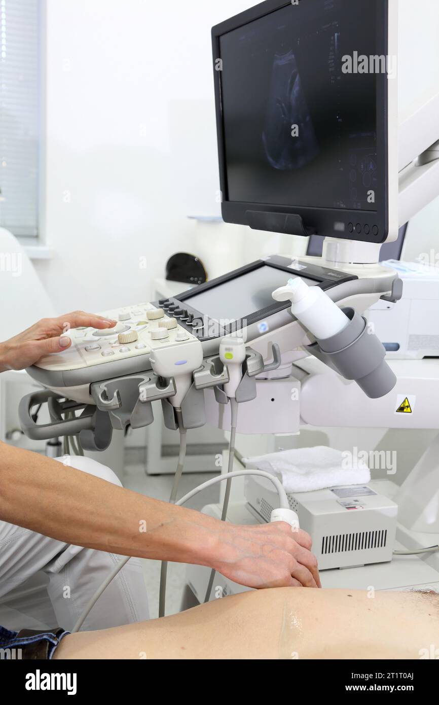 Ultrasonic examination of internal organs. A man on an abdominal ...