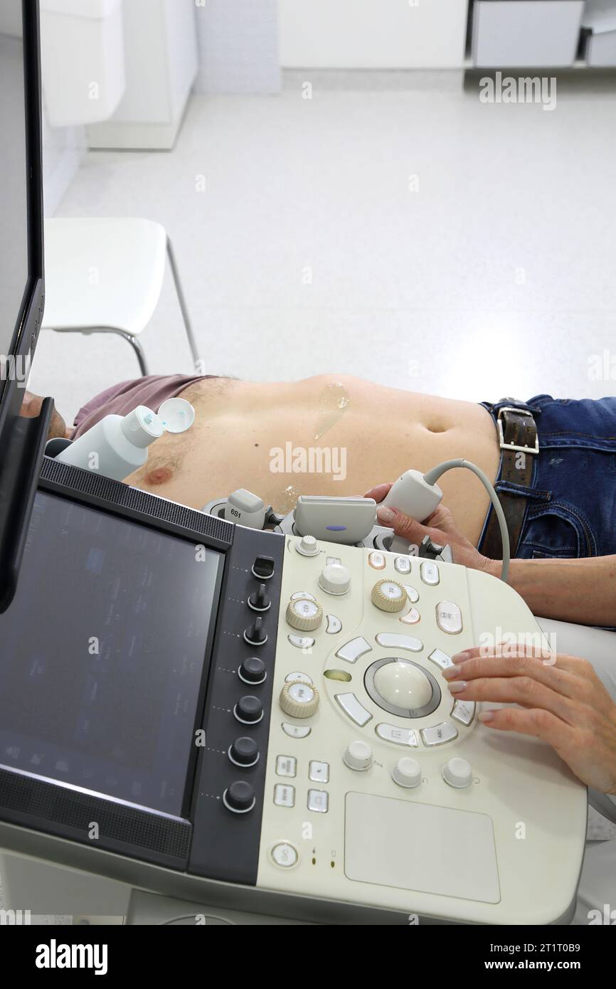 Ultrasonic examination of internal organs. A man on an abdominal ...