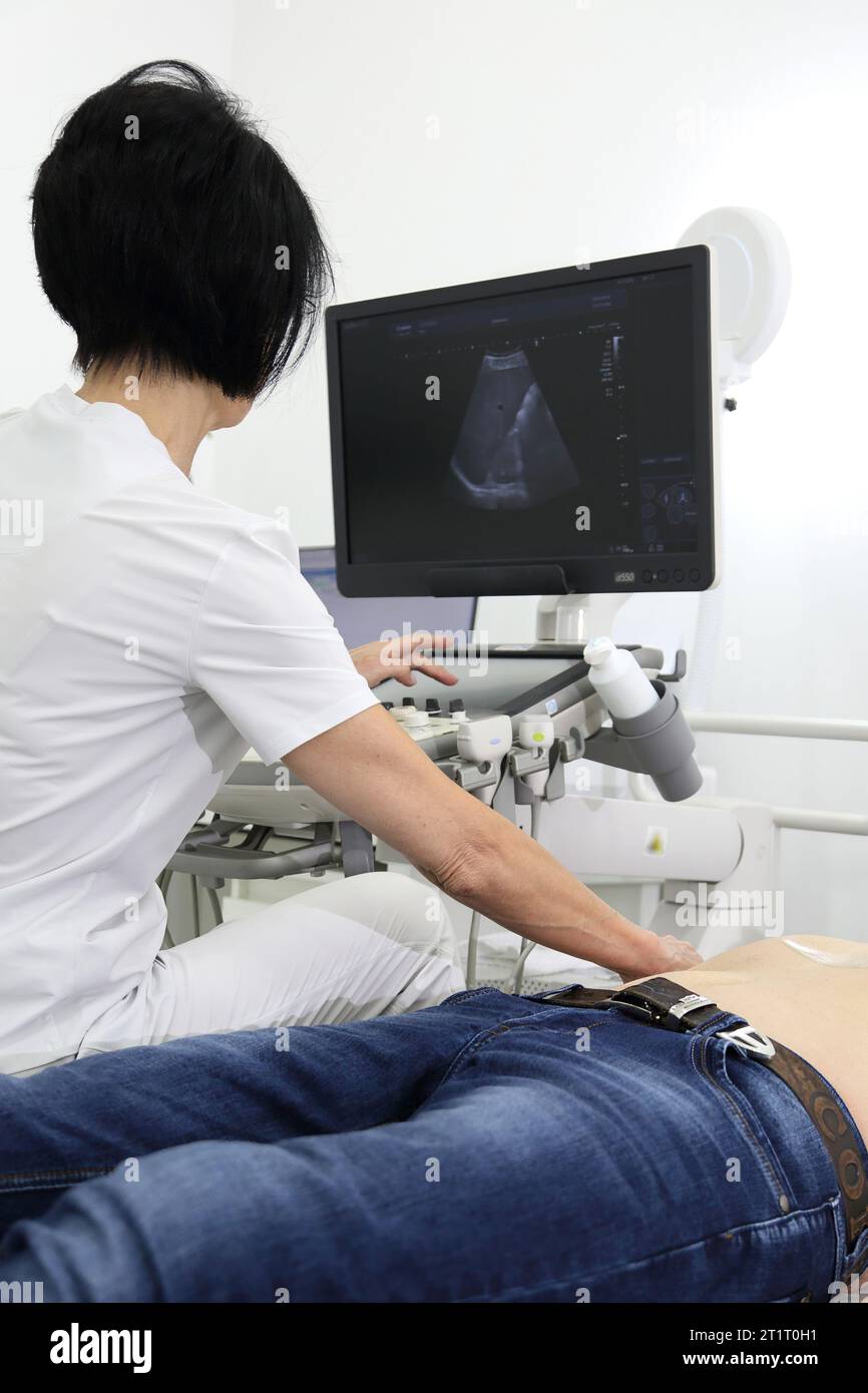 Ultrasonic examination of internal organs. A man on an abdominal ...