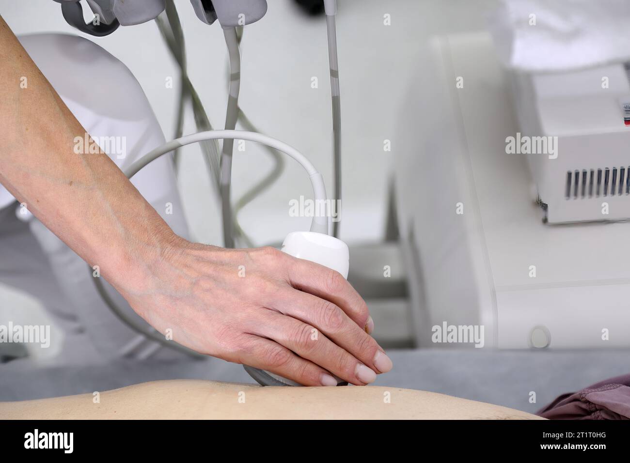 Ultrasonic examination of internal organs. A man on an abdominal ...