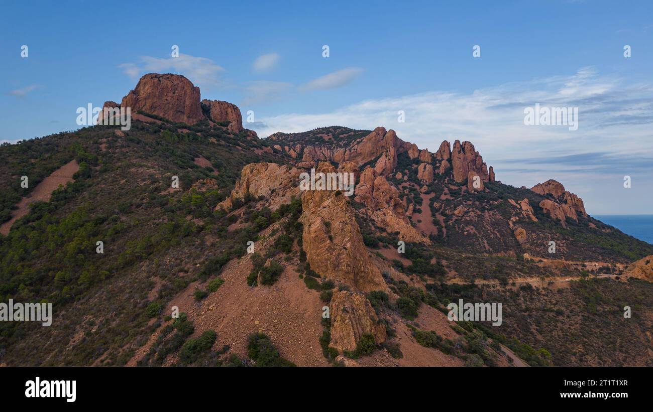 Aerial view of the Massif de L'Esterel and red cliffs falling into the ...