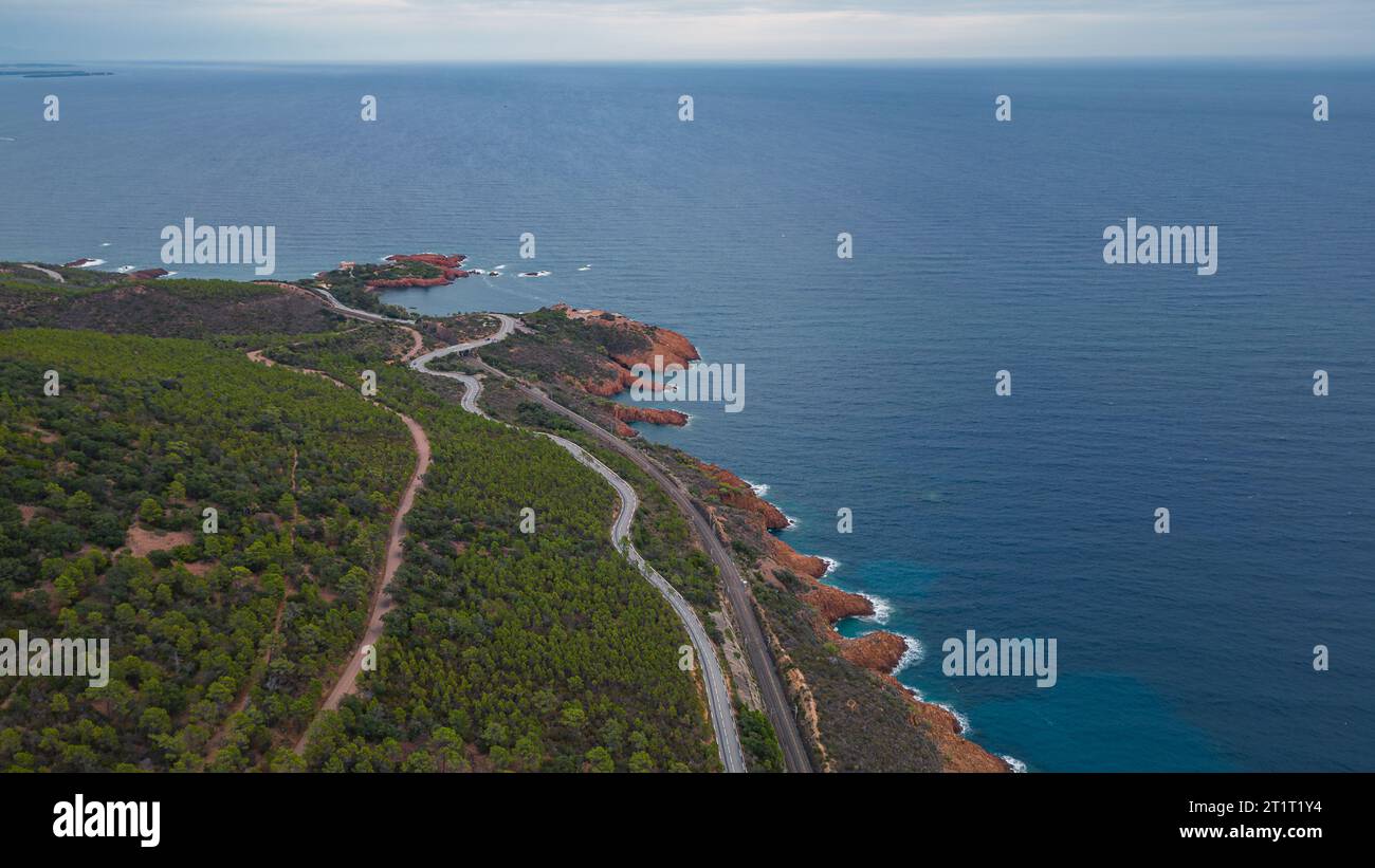 Aerial view of the Massif de L'Esterel and a beautiful winding road ...