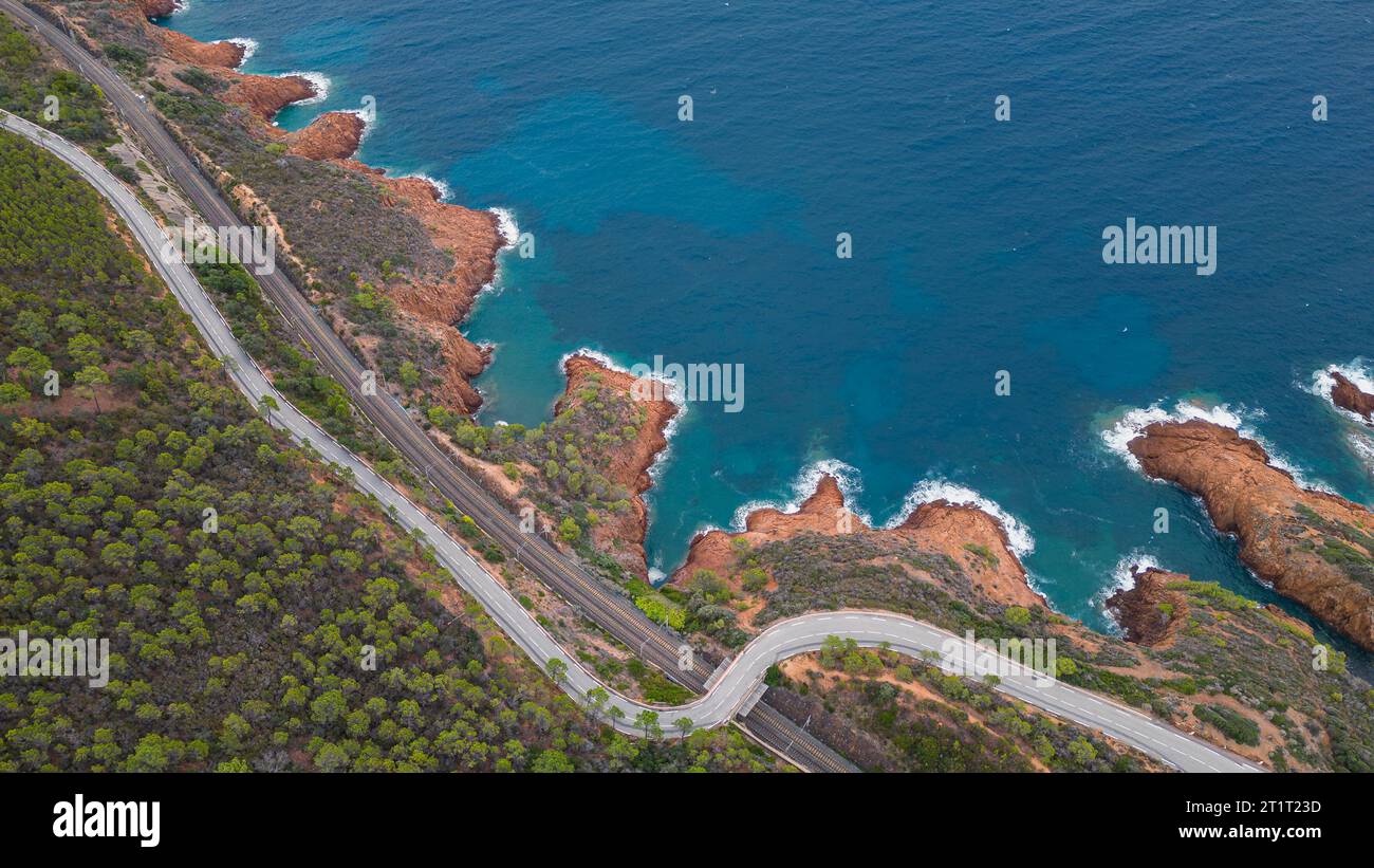 Aerial view of the Massif de L'Esterel and a beautiful winding road ...