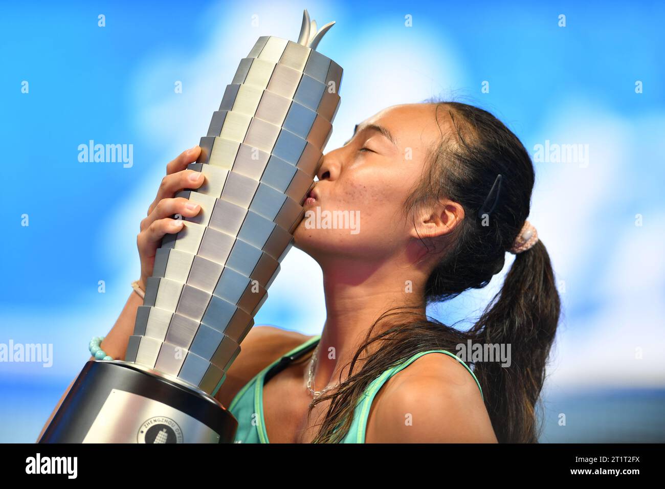 Zhengzhou, China's Henan Province. 15th Oct, 2023. Zheng Qinwen kisses ...