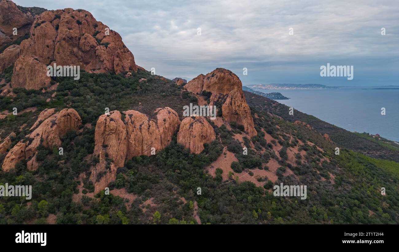 Aerial view of the Massif de L'Esterel and red cliffs falling into the ...