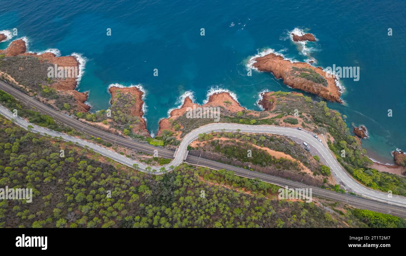 Aerial view of the Massif de L'Esterel and a beautiful winding road ...