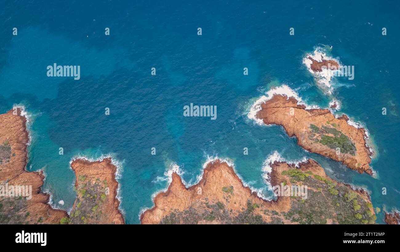 Aerial view of the Massif de L'Esterel and a beautiful winding road ...