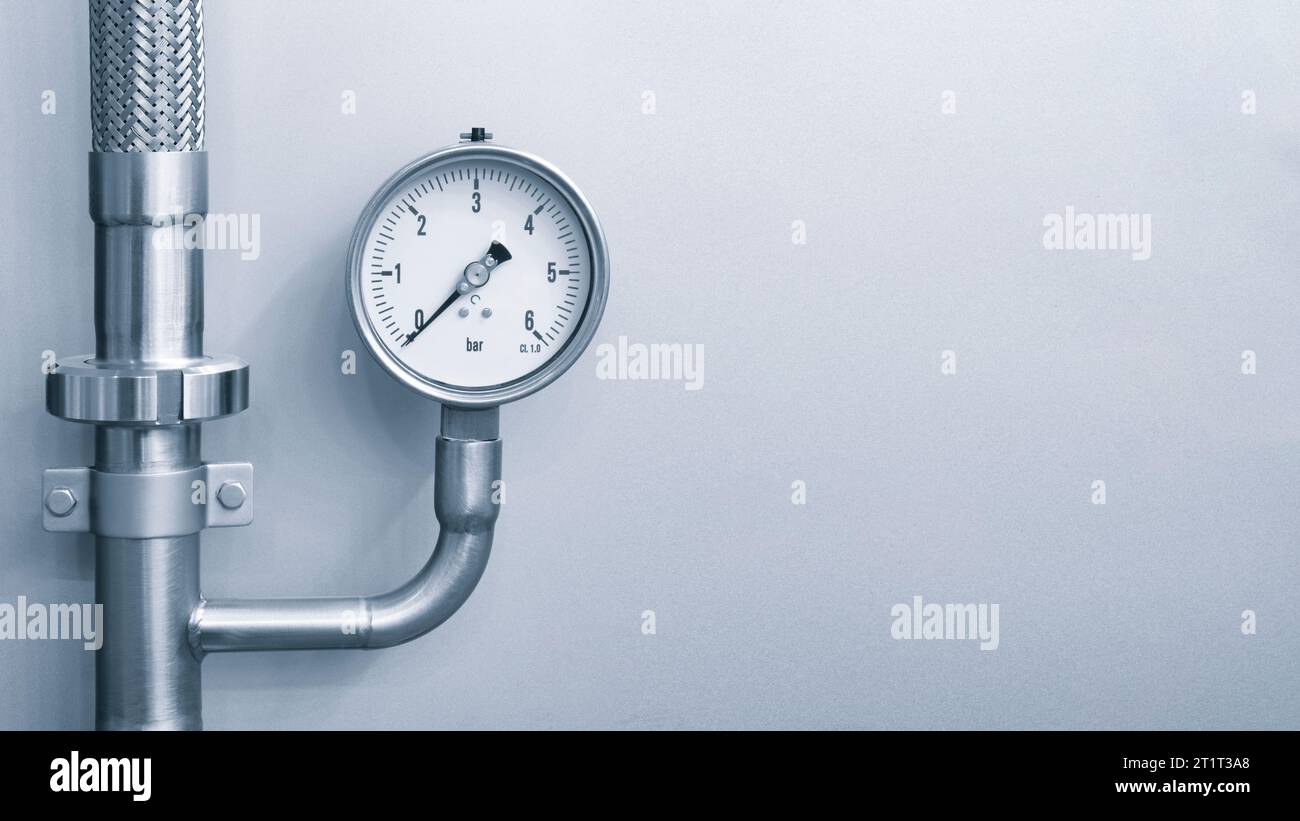 Manometer for measuring pressure on a blue metal background with free ...