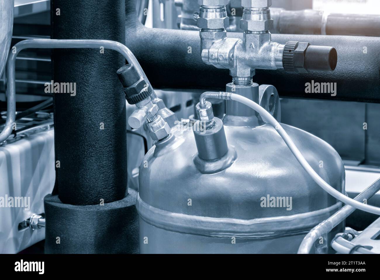 Modern industrial refrigeration equipment. Steel tanks and pipes ...