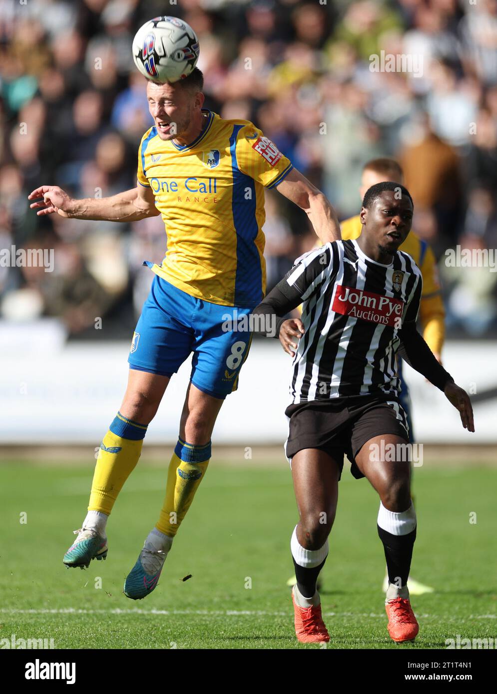 Mansfield Town’s Ollie Clarke battles for the ball with Notts County’s ...