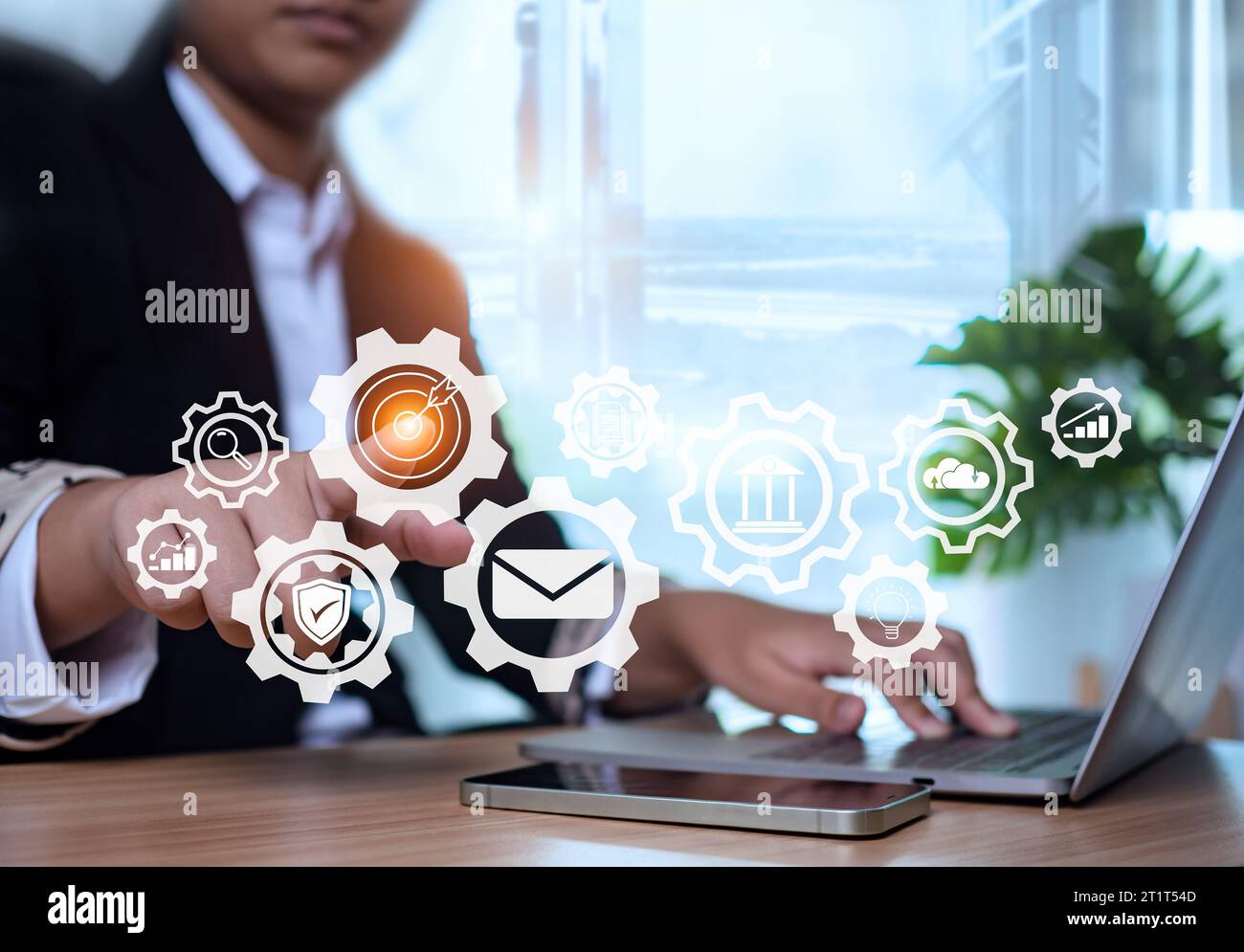 Businesswoman pointing at gears and icons. Operations management. Setting business goals ...