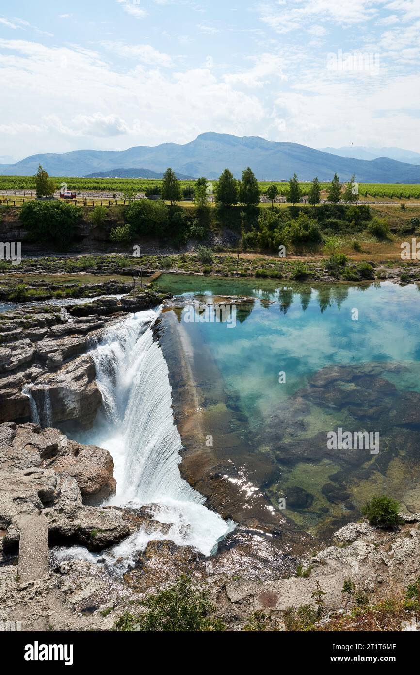 Niagara waterfall in Montenegro. Stream falling from rocks. Mountains ...