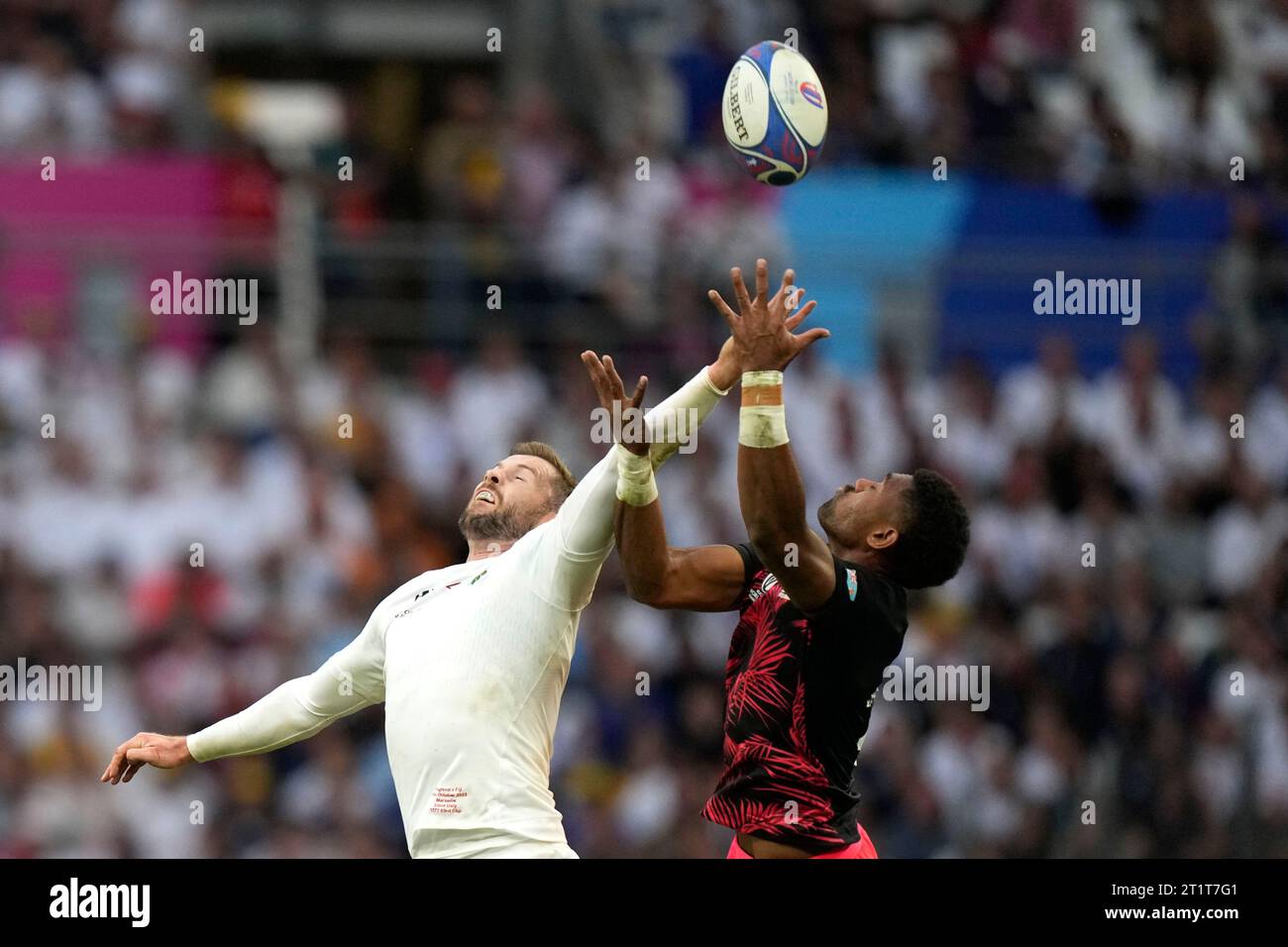 England's Elliot Daly and Fiji's Ilaisa Droasese go for the ball during ...