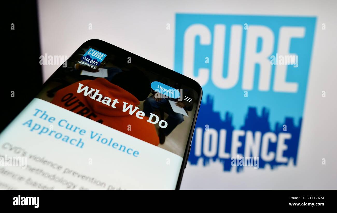 Mobile phone with website of US organization Cure Violence Global in ...