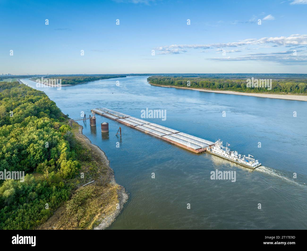 towboat with barges on the Mississippi River is entering Chain of Rocks ...