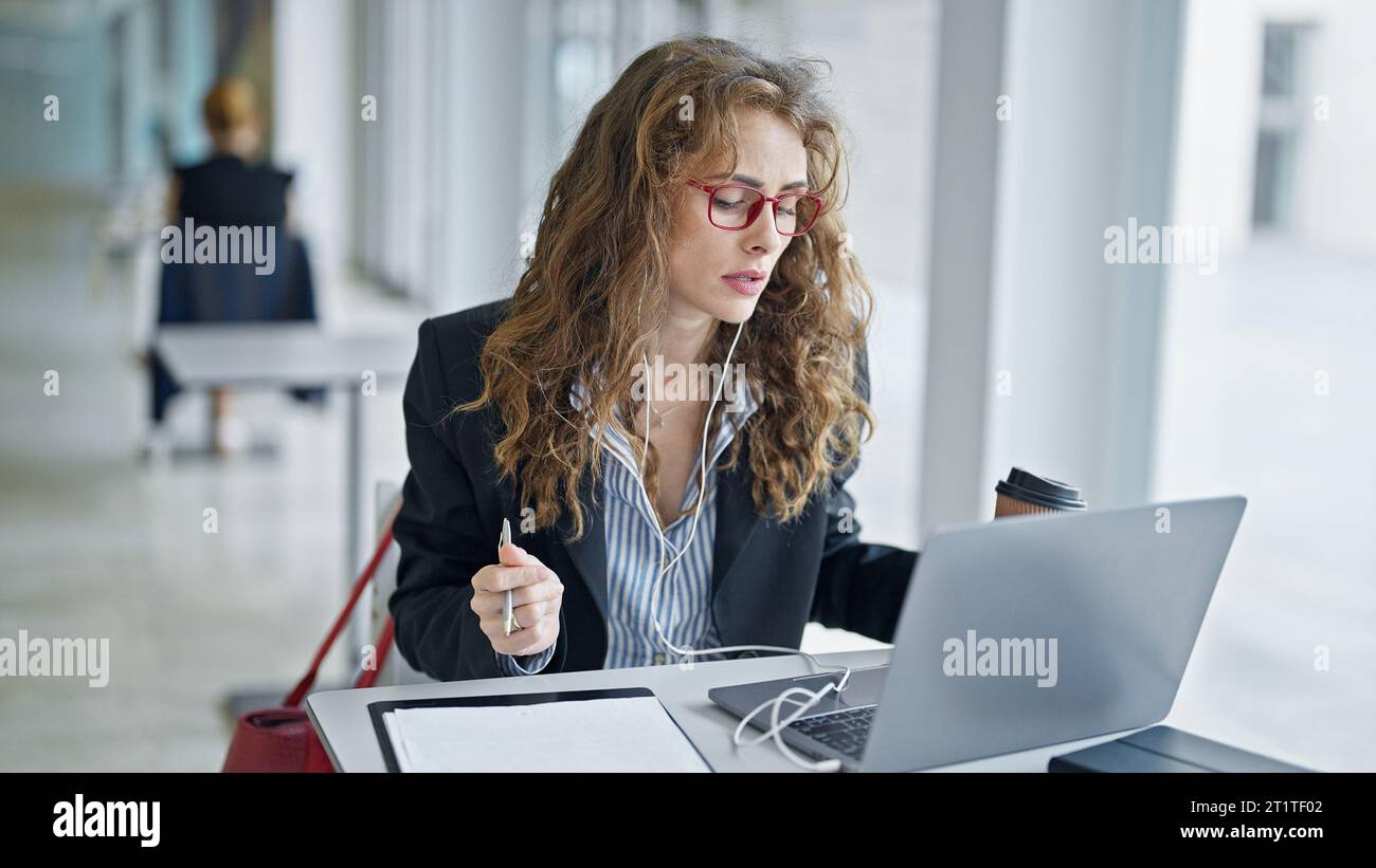 Young woman business worker having video call at the office Stock Photo ...