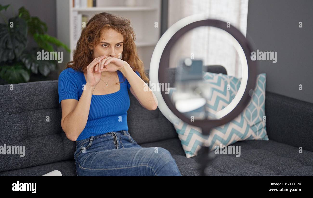 Young woman recording skin care video tutorial speaking at home Stock ...