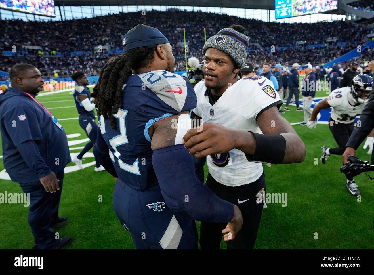Baltimore Ravens quarterback Lamar Jackson (8) hugs Tennessee Titans ...