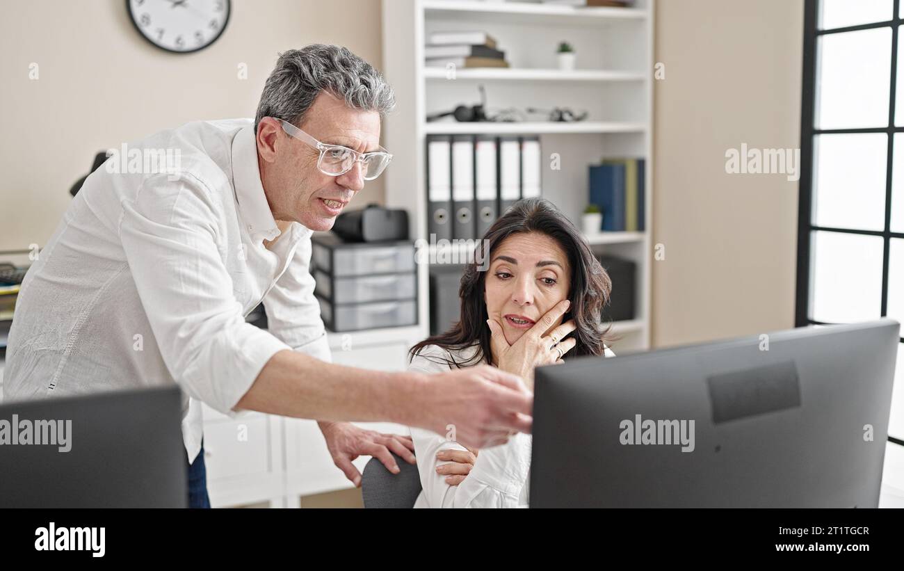 Senior man and woman business worker and boss arguing at office Stock ...
