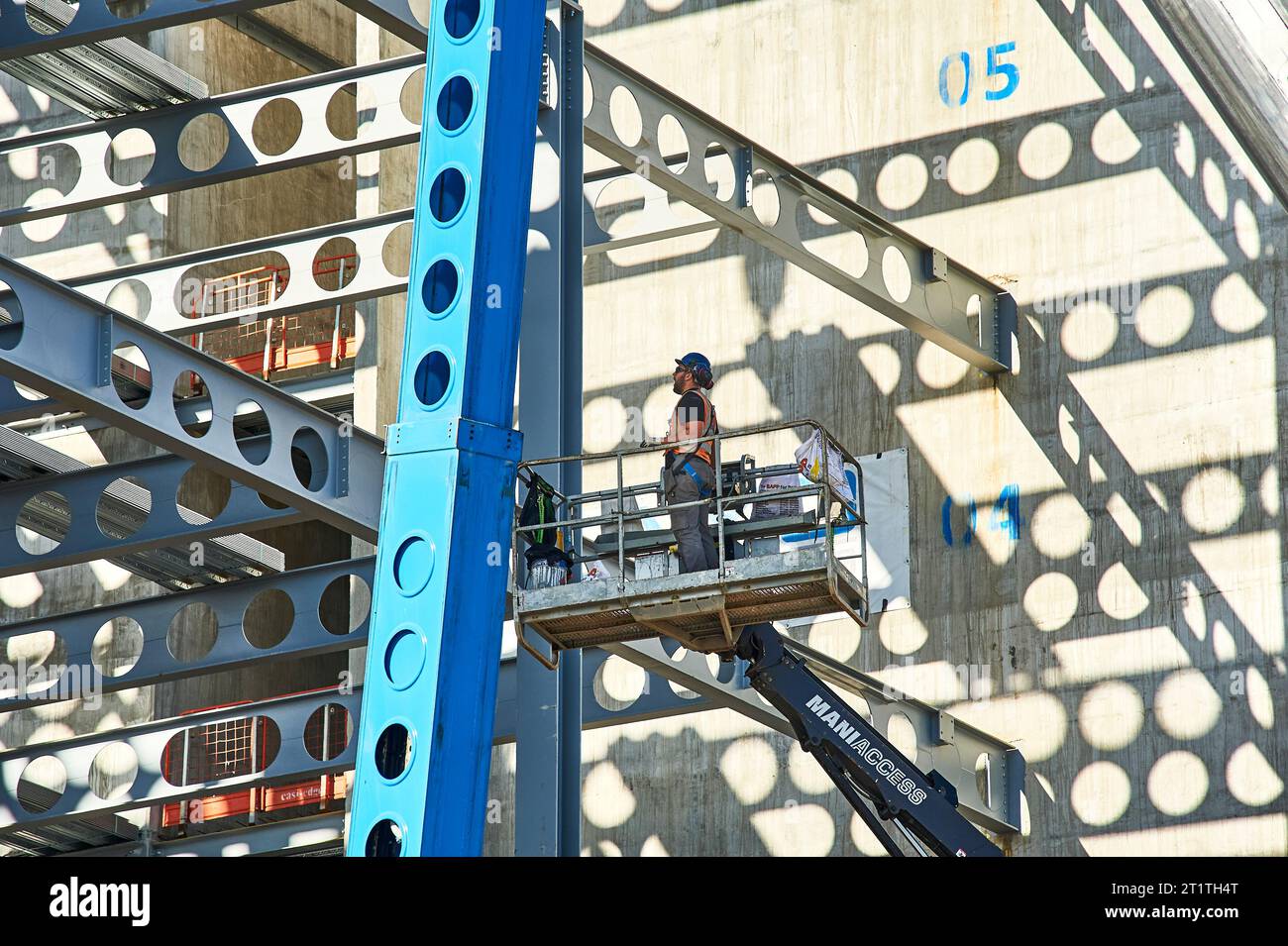 Construction worker on a platform at height working on the steel ...