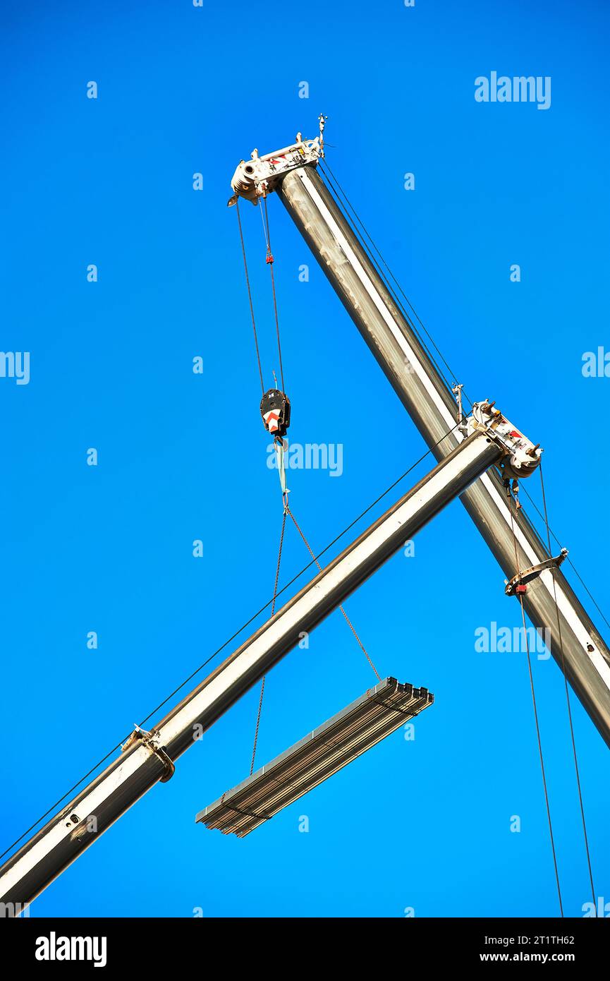 Lifting building materials hi-res stock photography and images - Alamy
