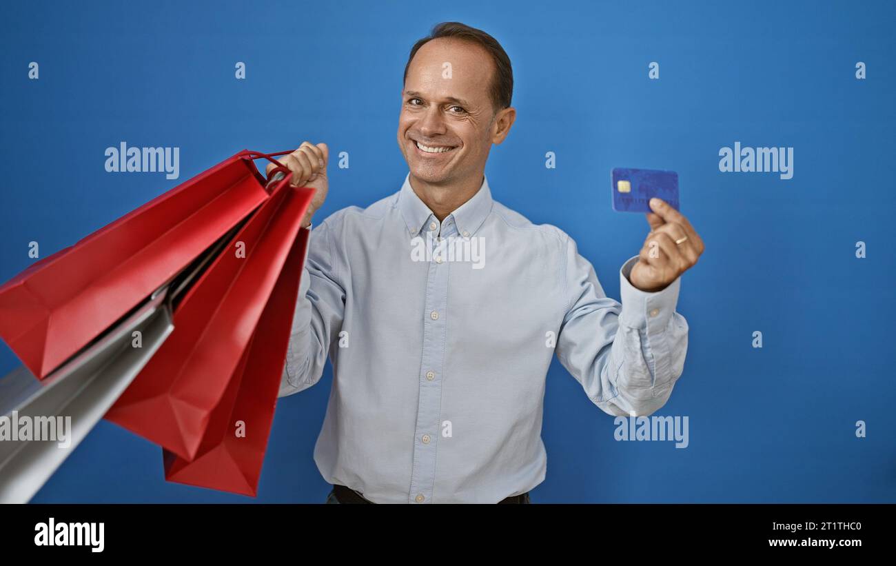 Confident, smiling middle aged man enjoys standing out as he makes a ...