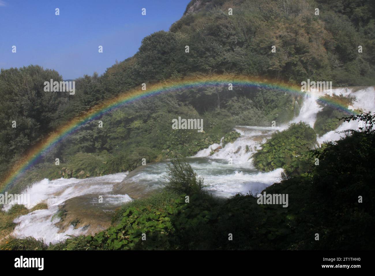 an incredible rainbow over the waterfall Stock Photo - Alamy