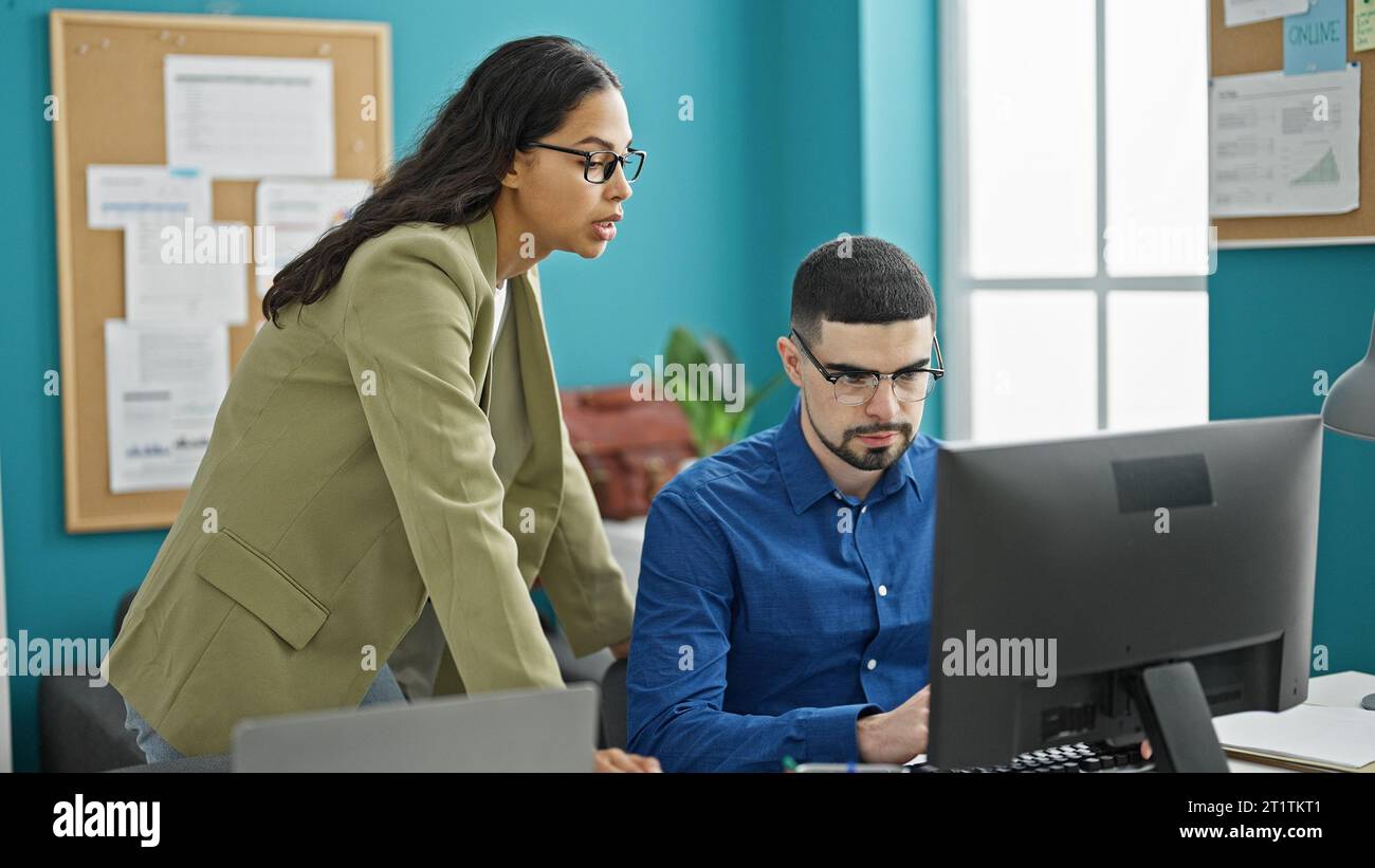 Dynamic duo at work, two professional workers, man and woman, conjuring ...