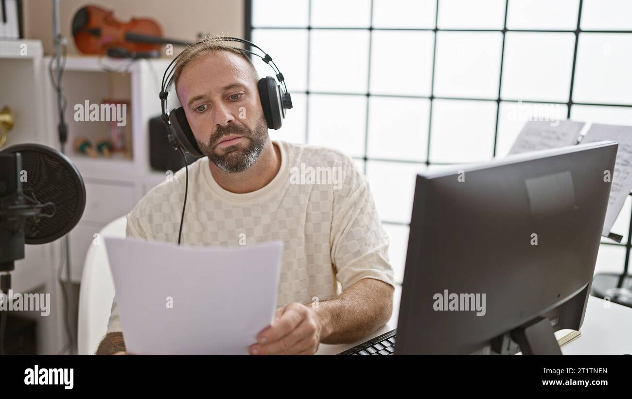 Handsome young man reporter on air, presenting live radio show from ...
