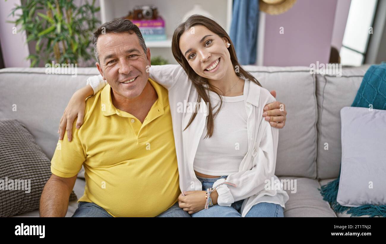 Joyful family time, father and daughter sharing a heartwarming hug ...