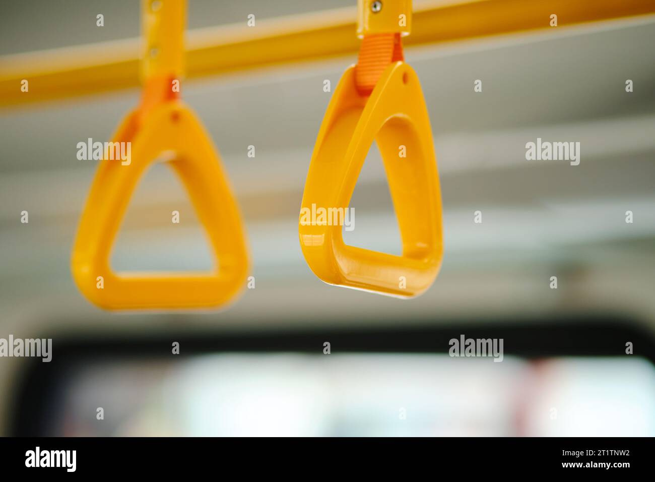 The plastic handles on the interior of the bus provide a secure grip ...