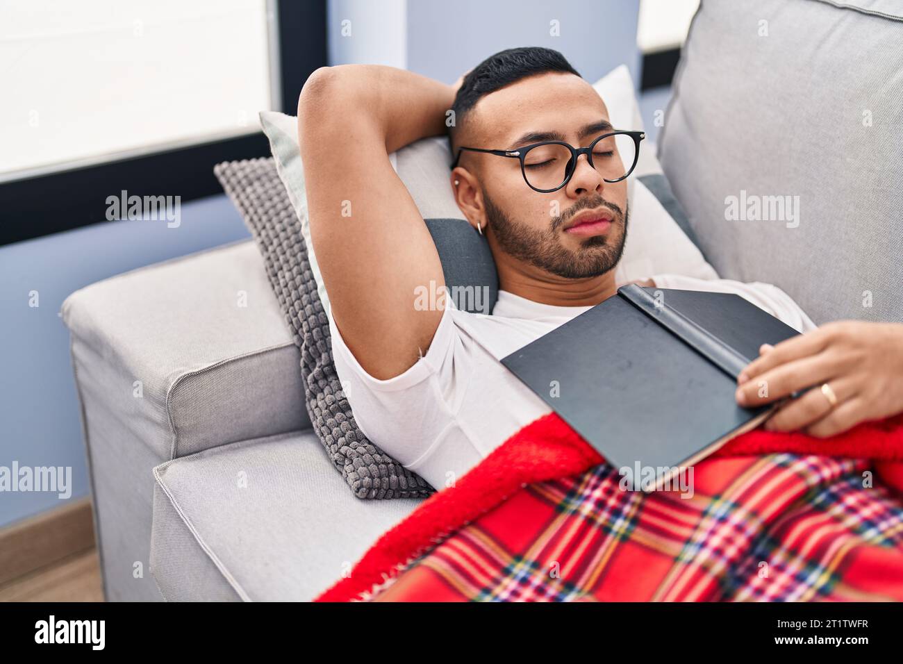 African american man lying on bed sleeping at home Stock Photo - Alamy