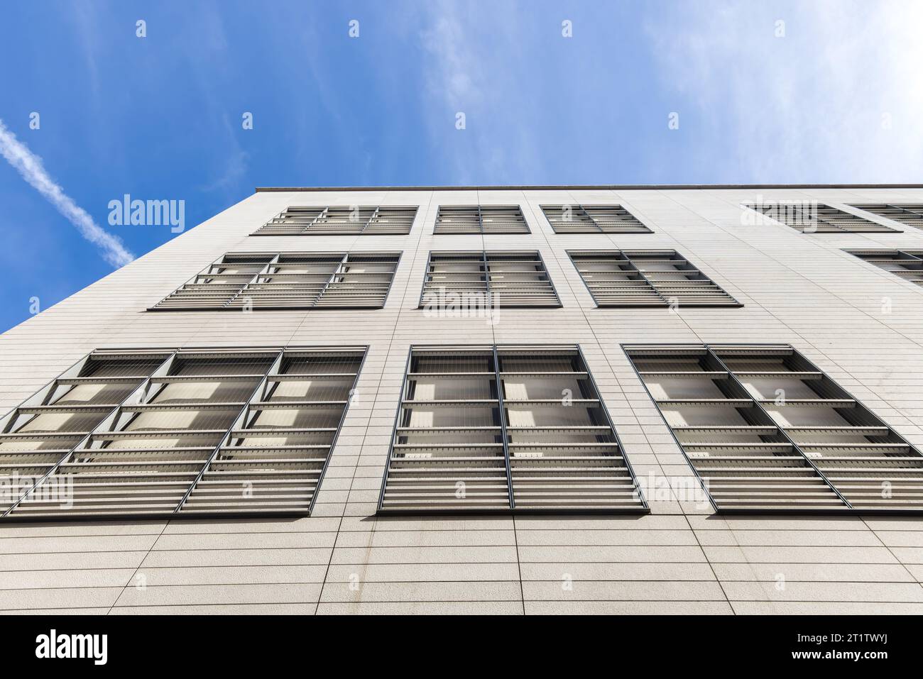 facade of an office building with window blinds for sun protection ...