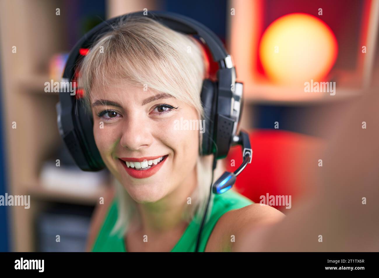 Young blonde woman streamer smiling confident make selfie by camera at ...