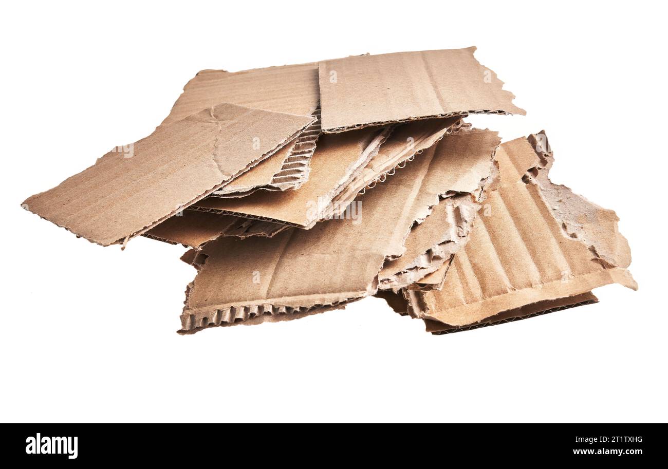 Stack of ripped pieces of cardboard material over isolated white ...