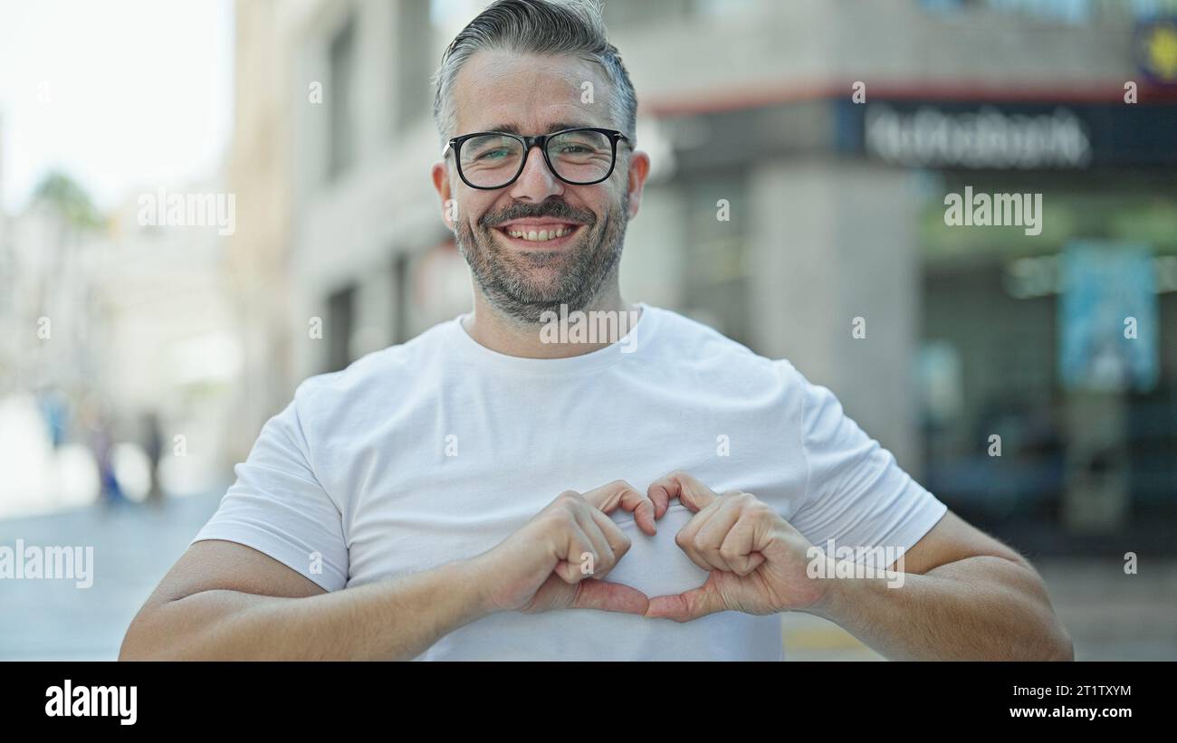 Grey haired hispanic man doing hi-res stock photography and images - Alamy