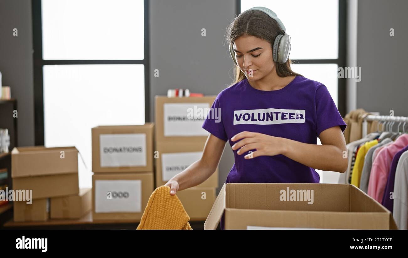 Woman packs donation box clothes hi-res stock photography and images ...