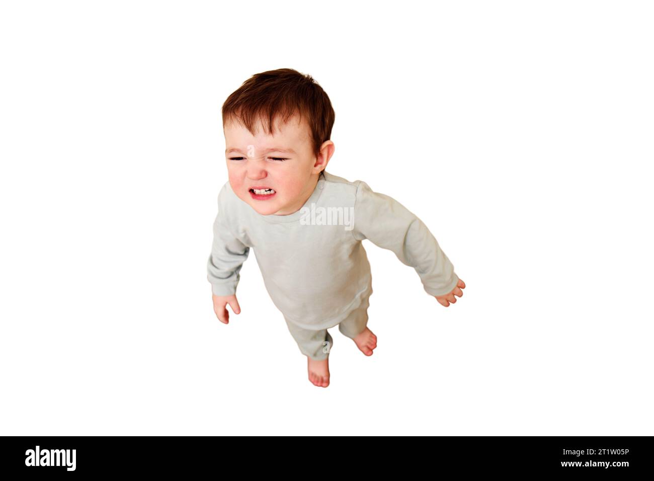 Little baby whimpers and is naughty, isolated on white background ...