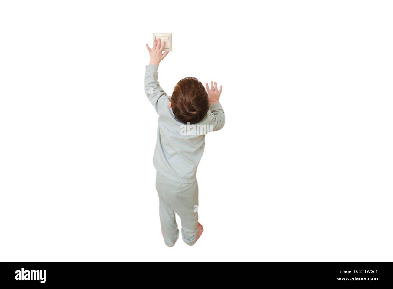 Little baby turns on the light by pressing the switch, isolated on ...
