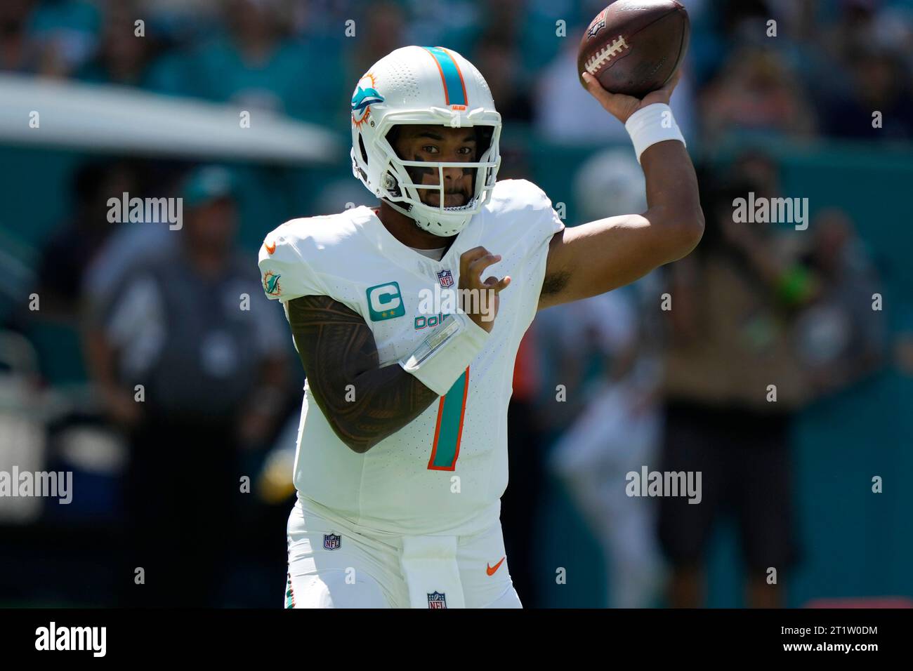 Miami Dolphins quarterback Tua Tagovailoa (1) aims a pass during the first half of an NFL ...