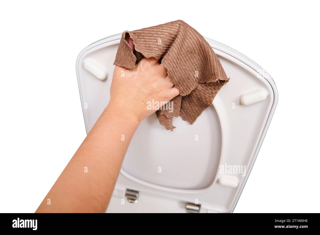 Woman cleaning toilet bowl with wet wipe in bathroom, isolated on white ...