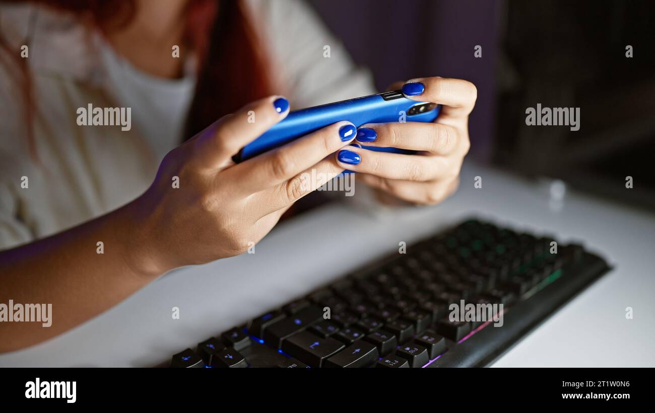 Game on! woman streamer's hands mastering video game on smartphone in ...